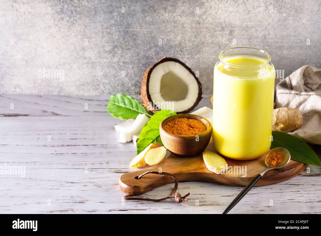 Cup of Healthy ayurvedic drink golden coconut milk turmeric iced latte ...