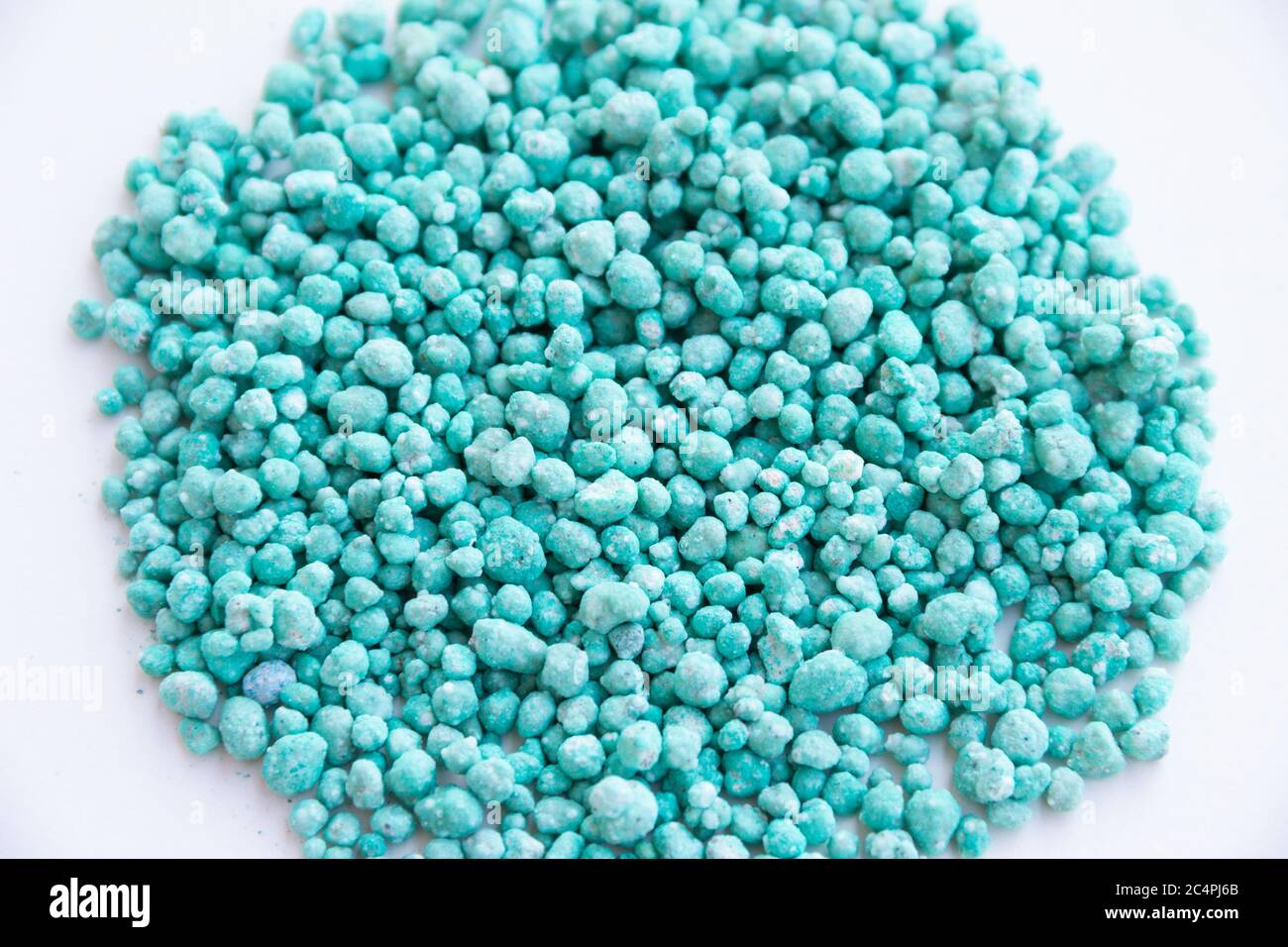 Green different shape chemical fertilizer granules Stock Photo - Alamy