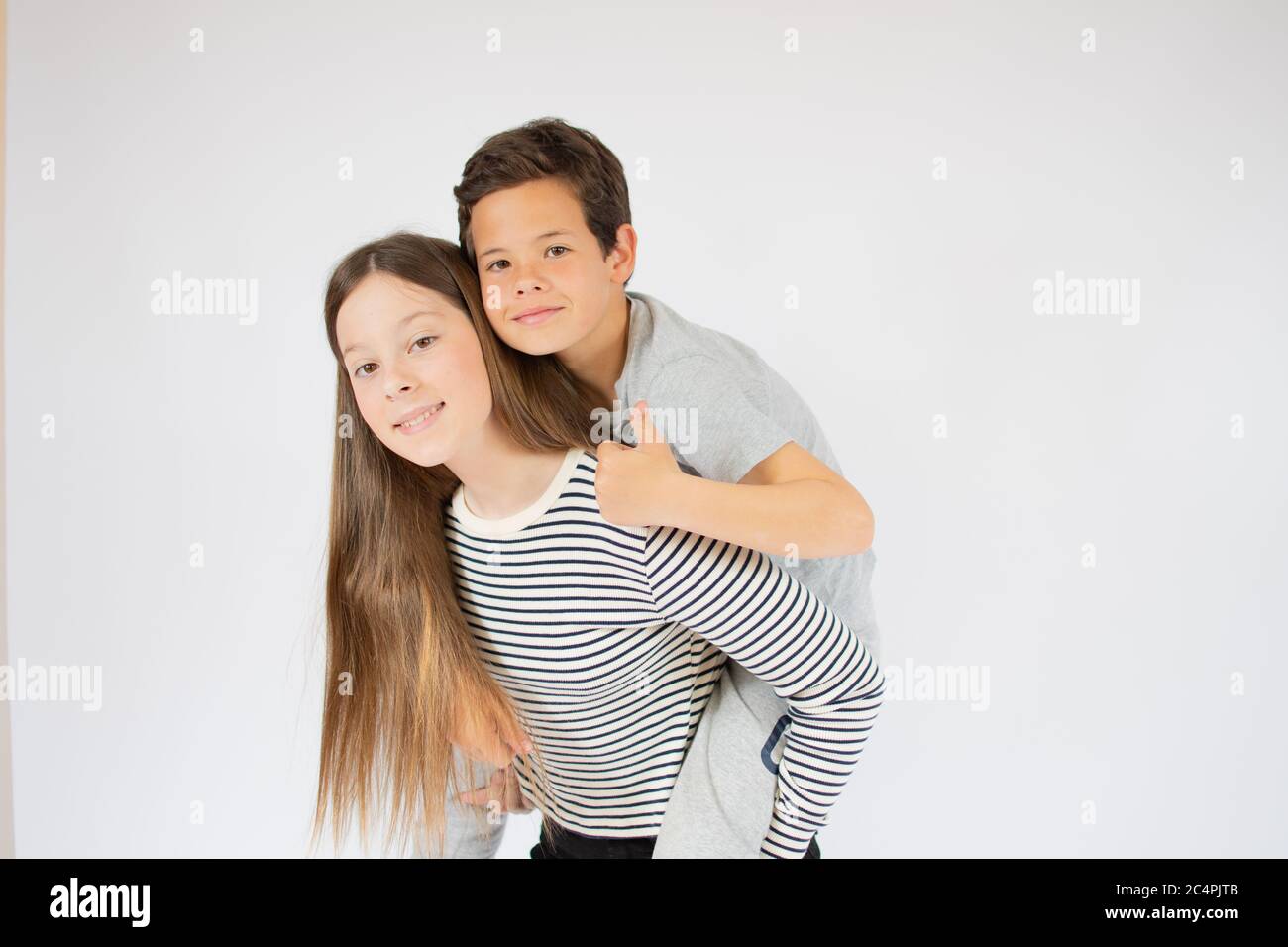 Two good friends hugging smiling Stock Photo - Alamy