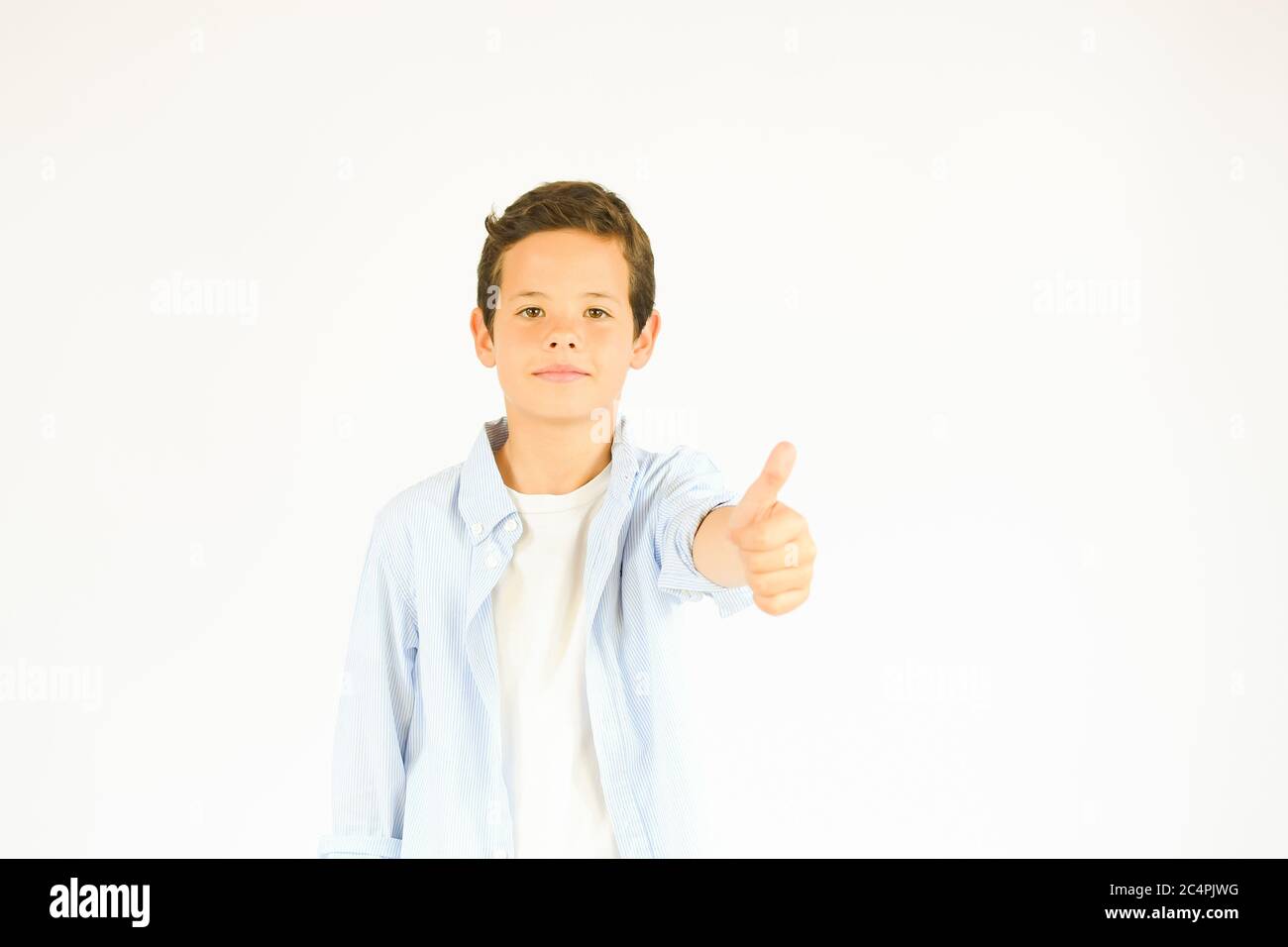 Happy boy making hand gesture Stock Photo - Alamy