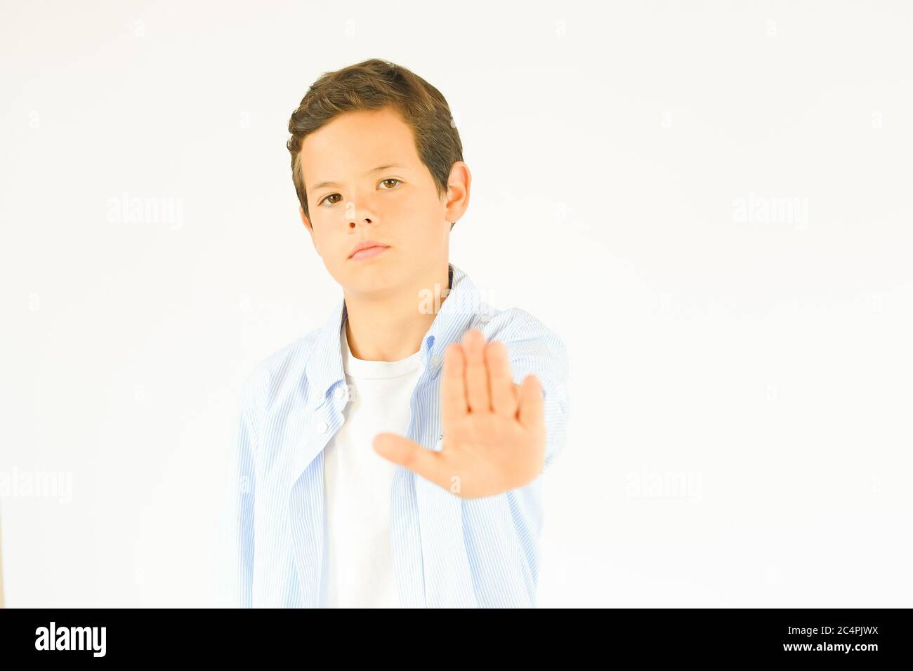 Happy boy making hand gesture Stock Photo - Alamy