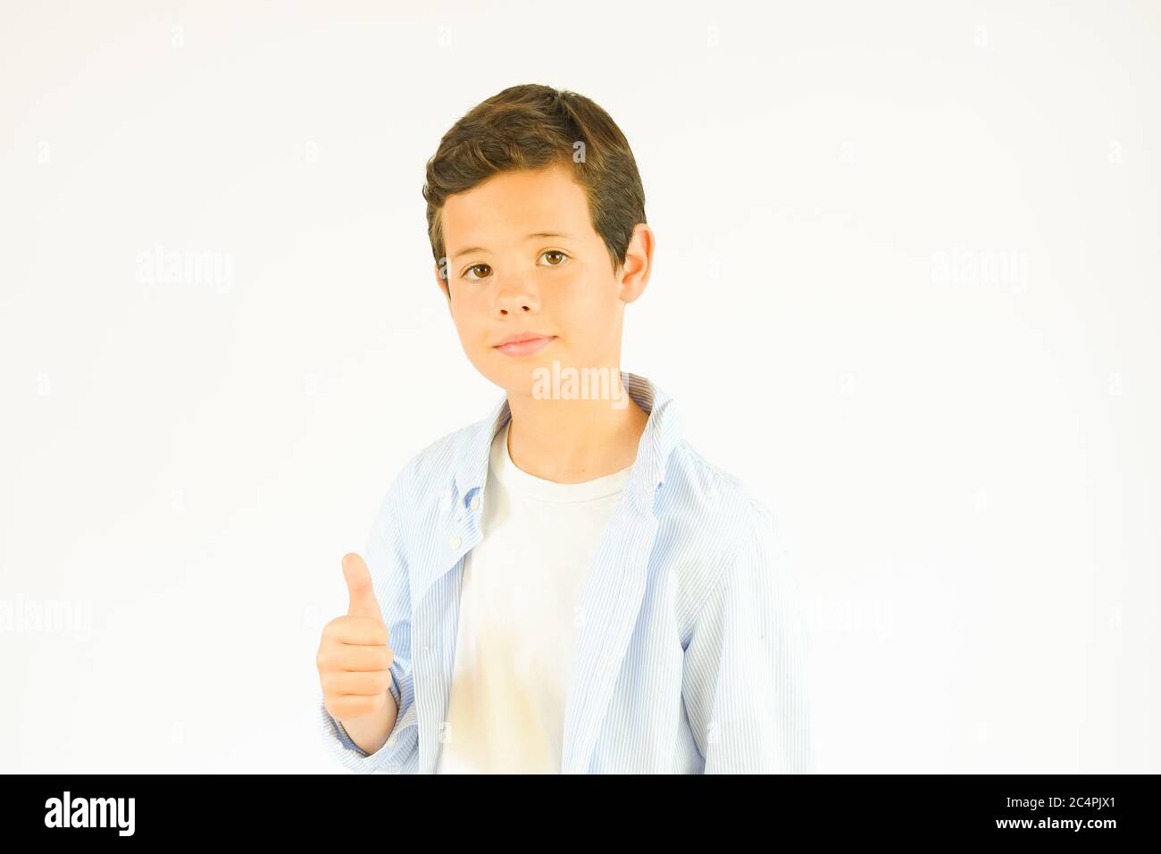 Happy boy making hand gesture Stock Photo - Alamy