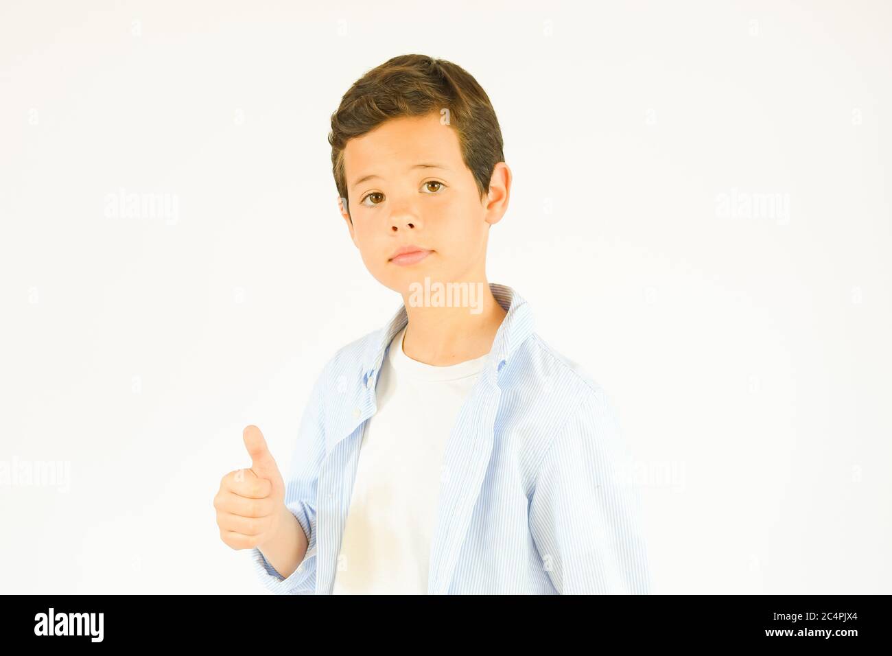 Happy boy making hand gesture Stock Photo - Alamy