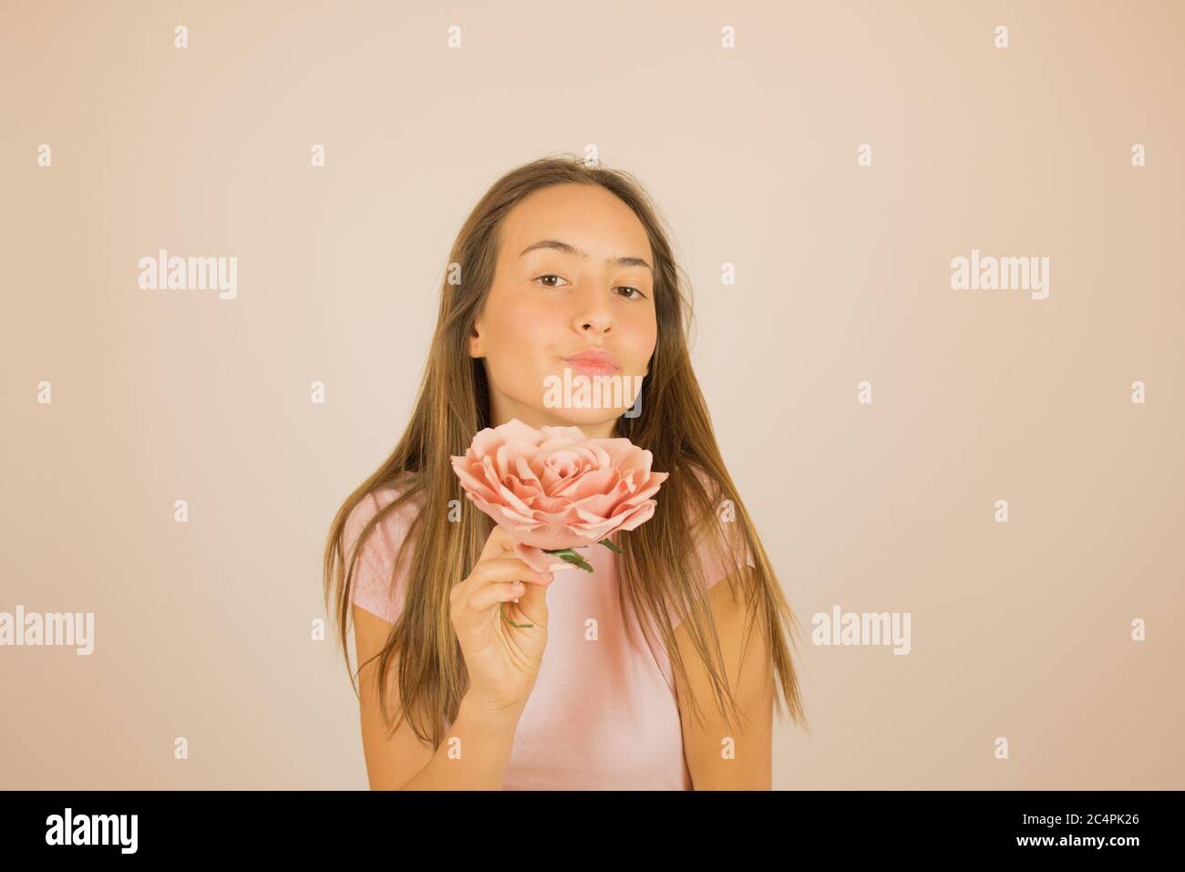 Beautiful girl with rose in her hand Stock Photo - Alamy