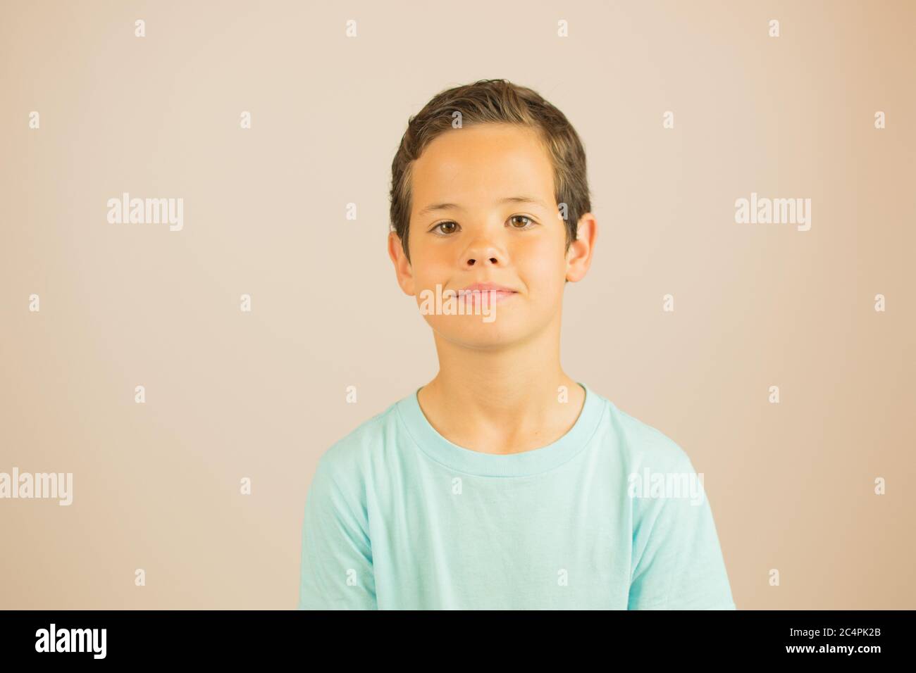 Pretty boy looking into the camera Stock Photo - Alamy