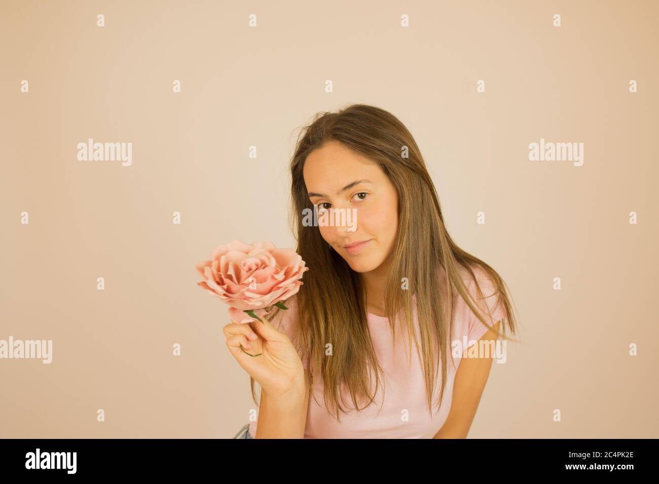 Beautiful girl with rose in her hand Stock Photo - Alamy