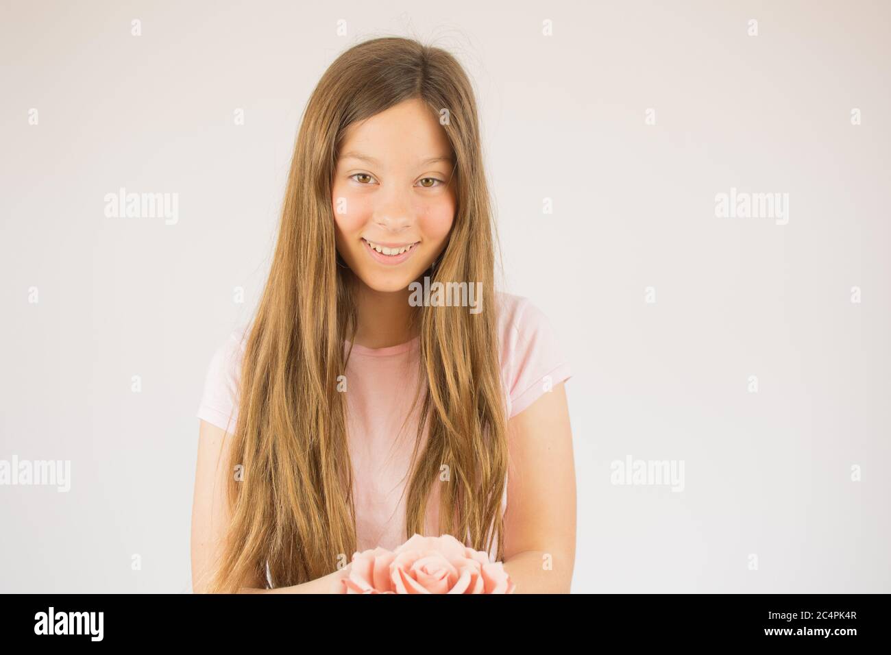 Beautiful girl with rose in her hand Stock Photo - Alamy
