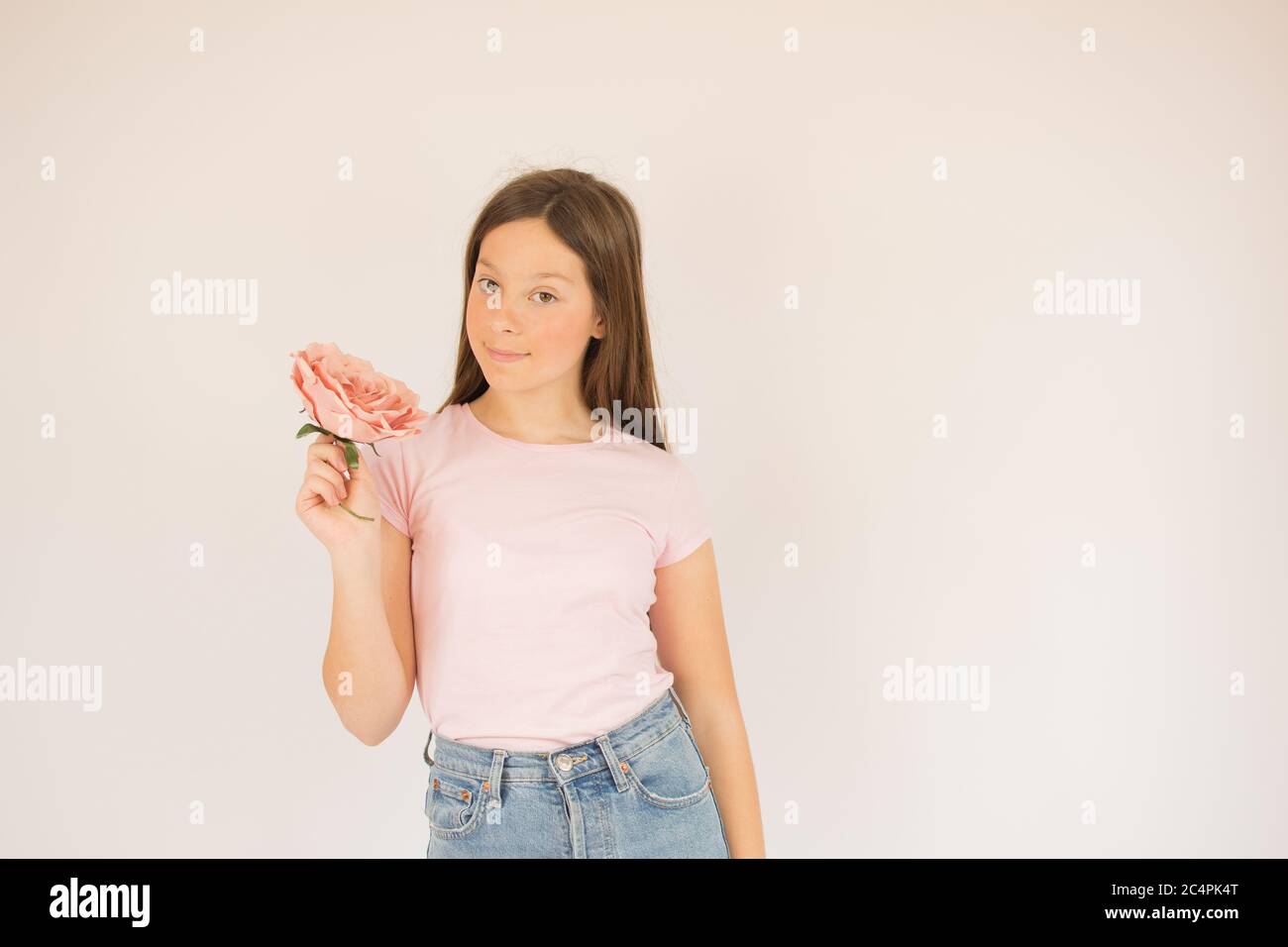 Beautiful girl with rose in her hand Stock Photo - Alamy