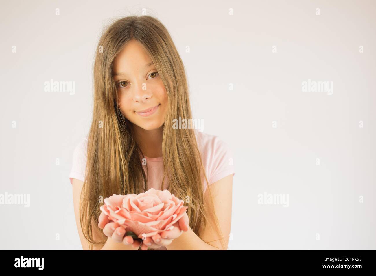 Beautiful girl with rose in her hand Stock Photo - Alamy