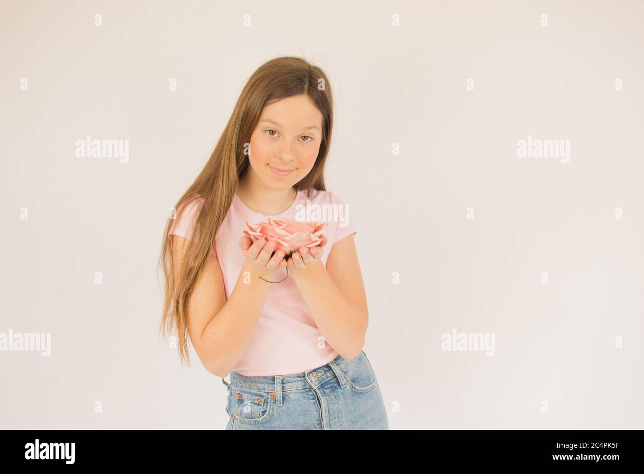 Beautiful girl with rose in her hand Stock Photo - Alamy