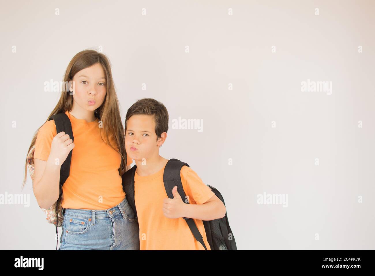 Boy and girls ready for school Stock Photo - Alamy