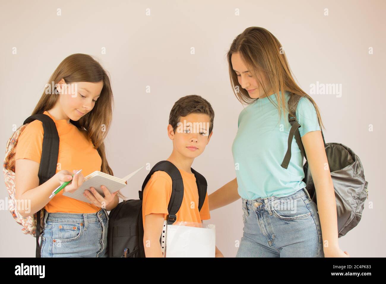 Boy and girls ready for school Stock Photo - Alamy
