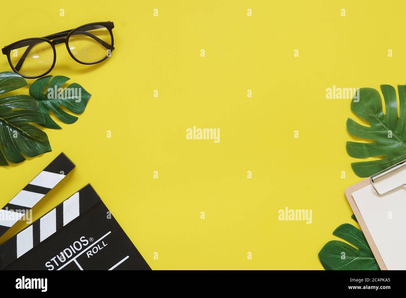 Vintage red clock in coffee time on filmmaker office table top view ...