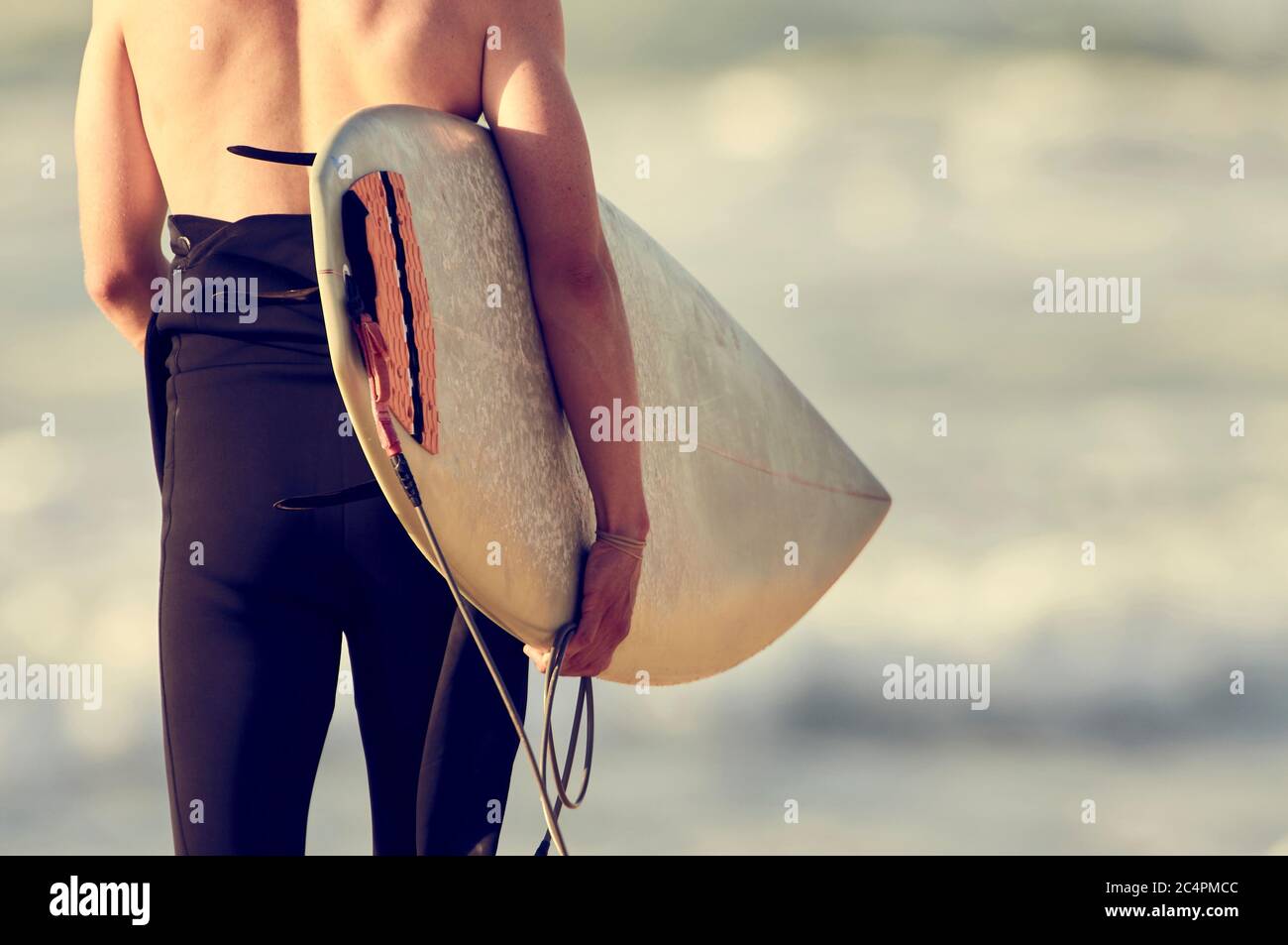 Man with board ready to surf Stock Photo - Alamy