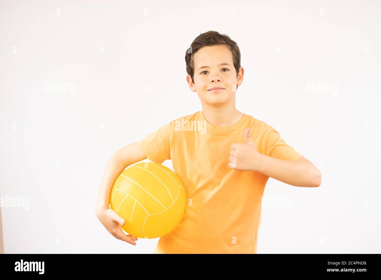 Smiling boy with a ball Stock Photo - Alamy