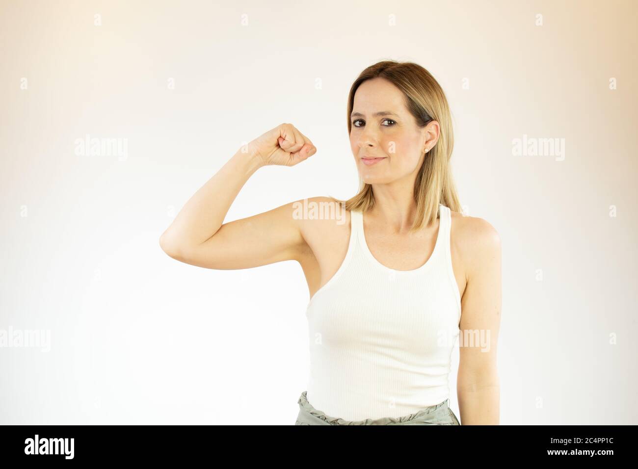 Beautiful woman making gesture with her arm Stock Photo - Alamy