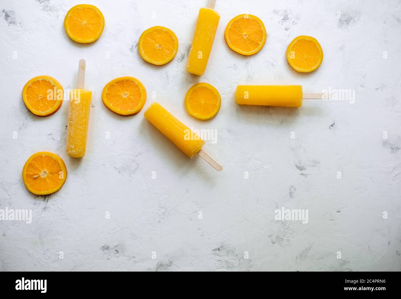 Orange fruit ice sorbet with slices of fresh orange. Stick ice cream ...