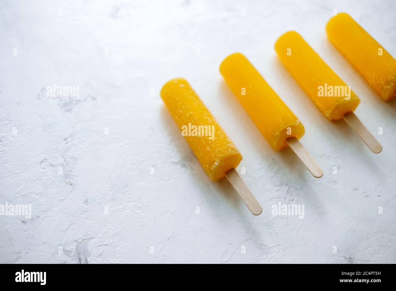 Orange fruit ice isolated on a white background. Stick ice cream Stock ...