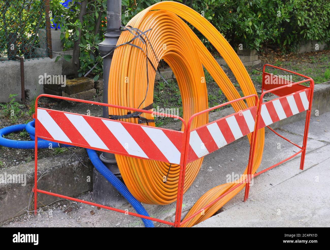 pipe to lay the fiber optic infrastructure in a city road construction ...