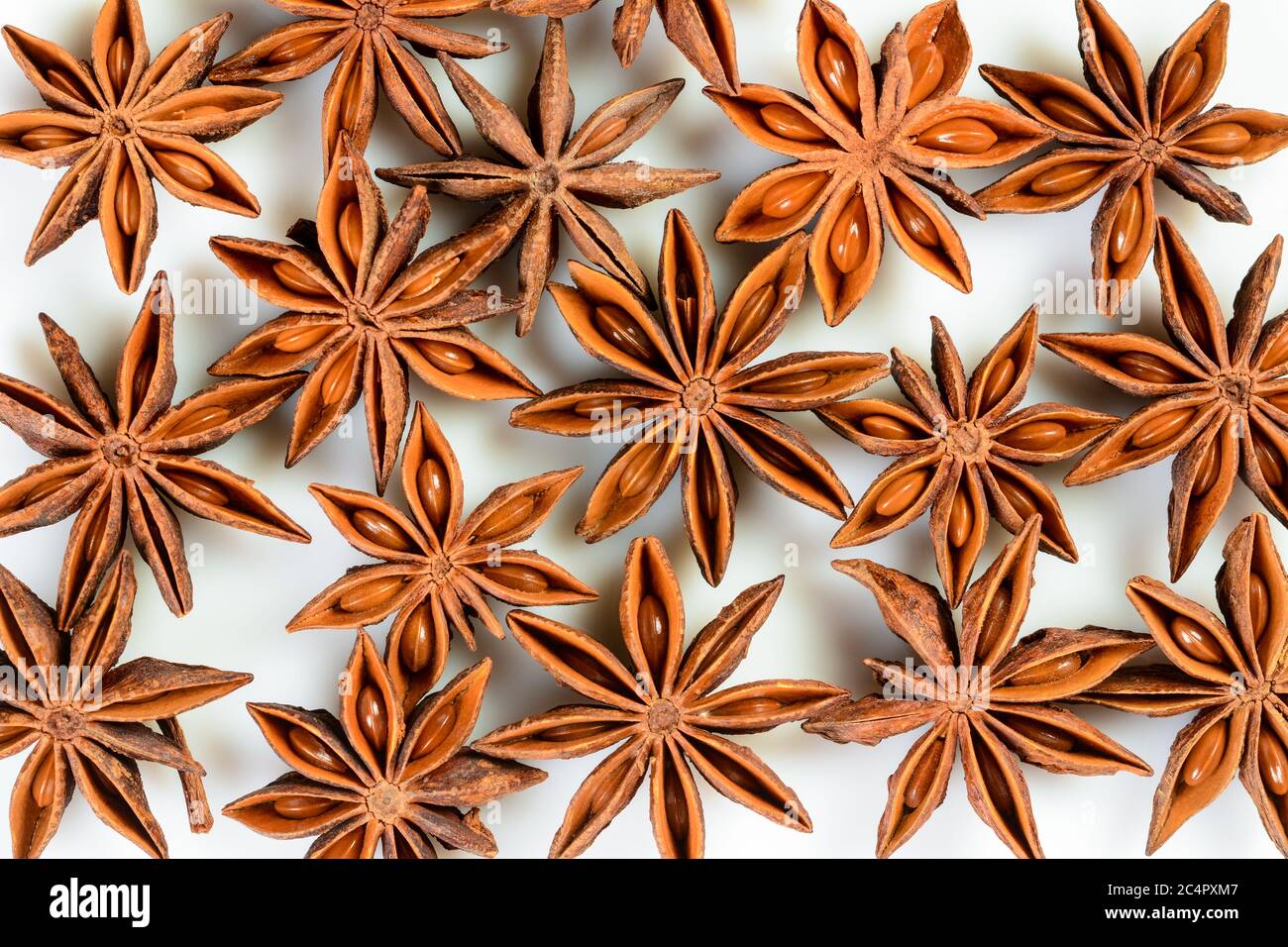 Star anise fruit background and texture. Macro close-up on white ...
