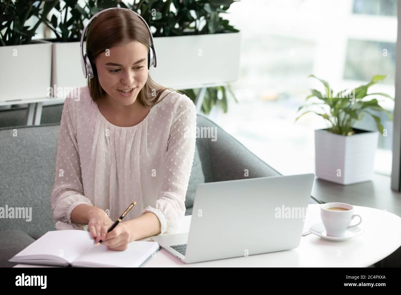 Woman calling headphones hi-res stock photography and images - Alamy