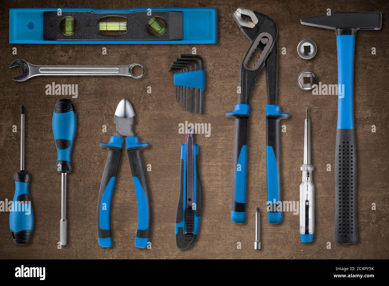 Flat lay with multiple work tools on white background with a soft ...
