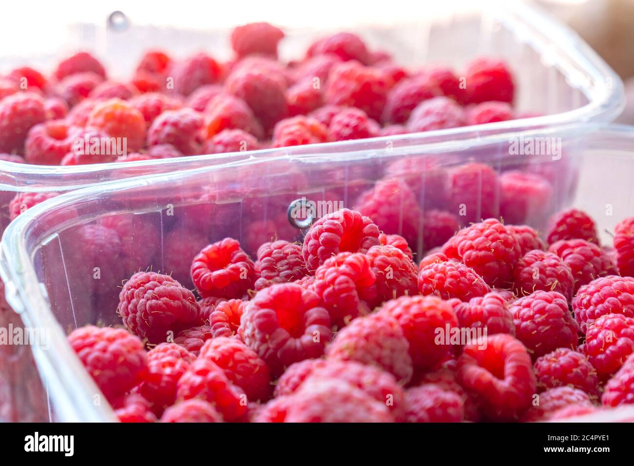 Red raspberries in plastic package box, fruit Stock Photo - Alamy