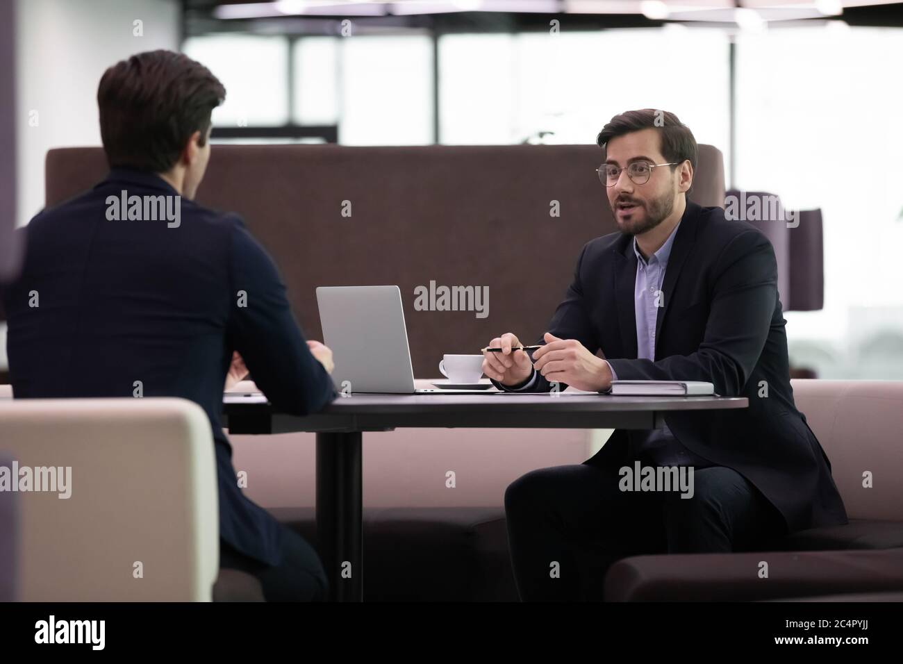 Job interview, hr manager interviewing male candidate asking questions ...