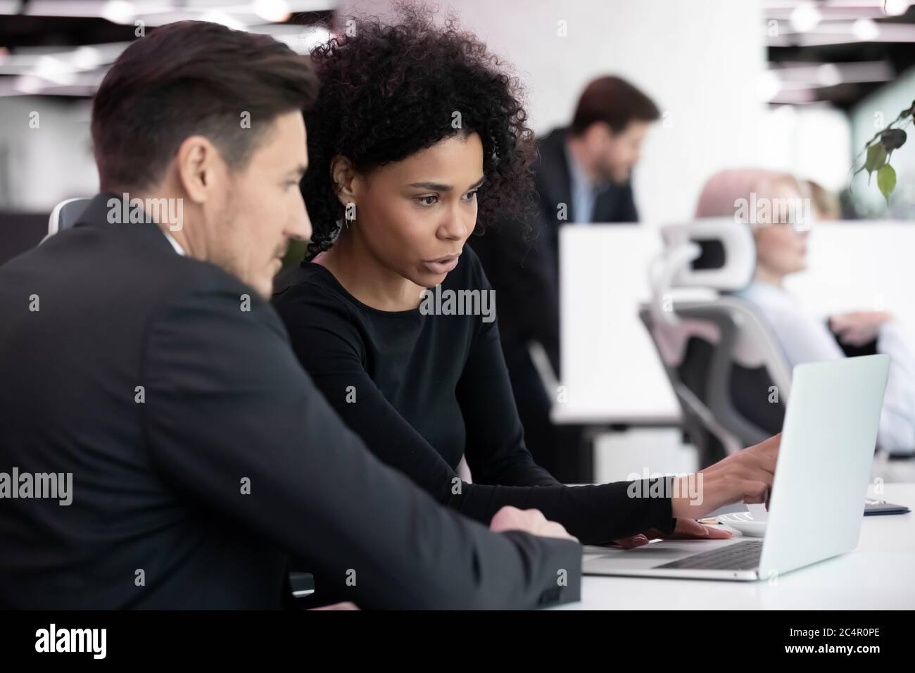 Diverse business people using computer hi-res stock photography and ...