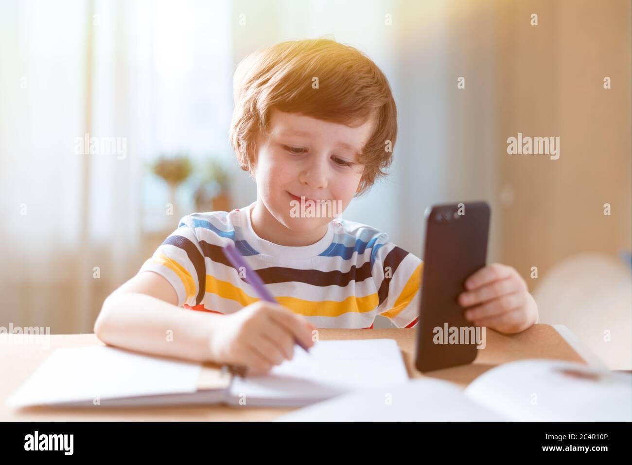 Distance learning online education. Caucasian smile kid boy studying at ...