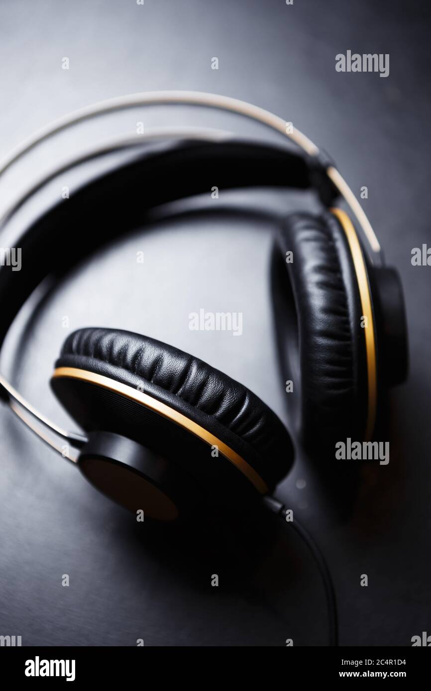 Listen to the music with professional headphones.Big black headset with ...