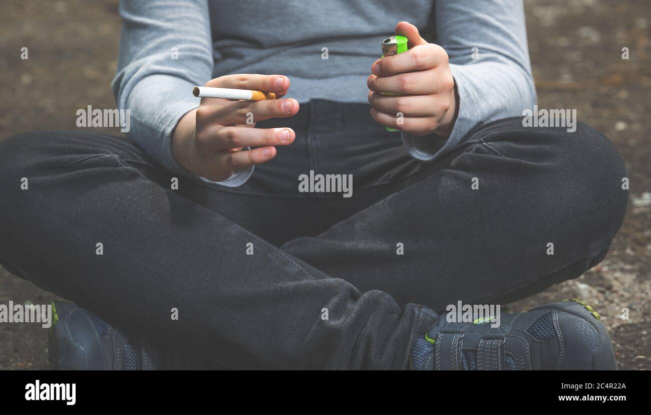 Health and social problem or issue concept, school young boy holding a ...