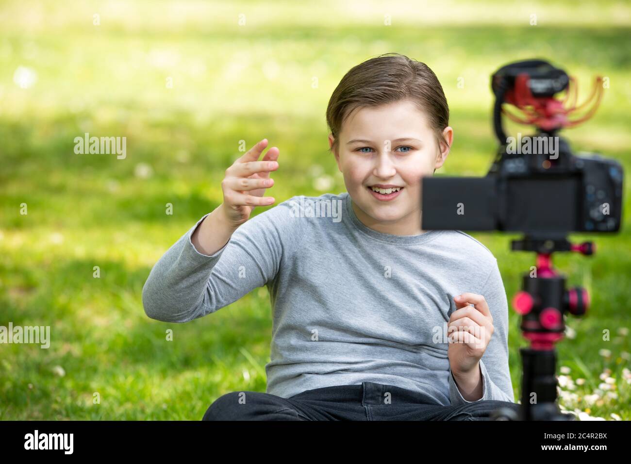 Blogging and vlogging concept, happy smiling boy or blogger with camera ...