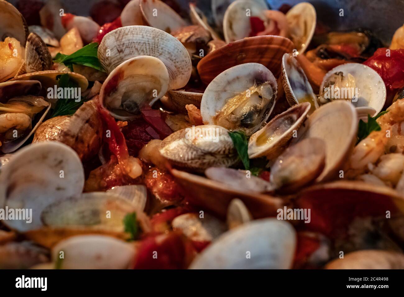 A pan full of a sea sauce Stock Photo - Alamy