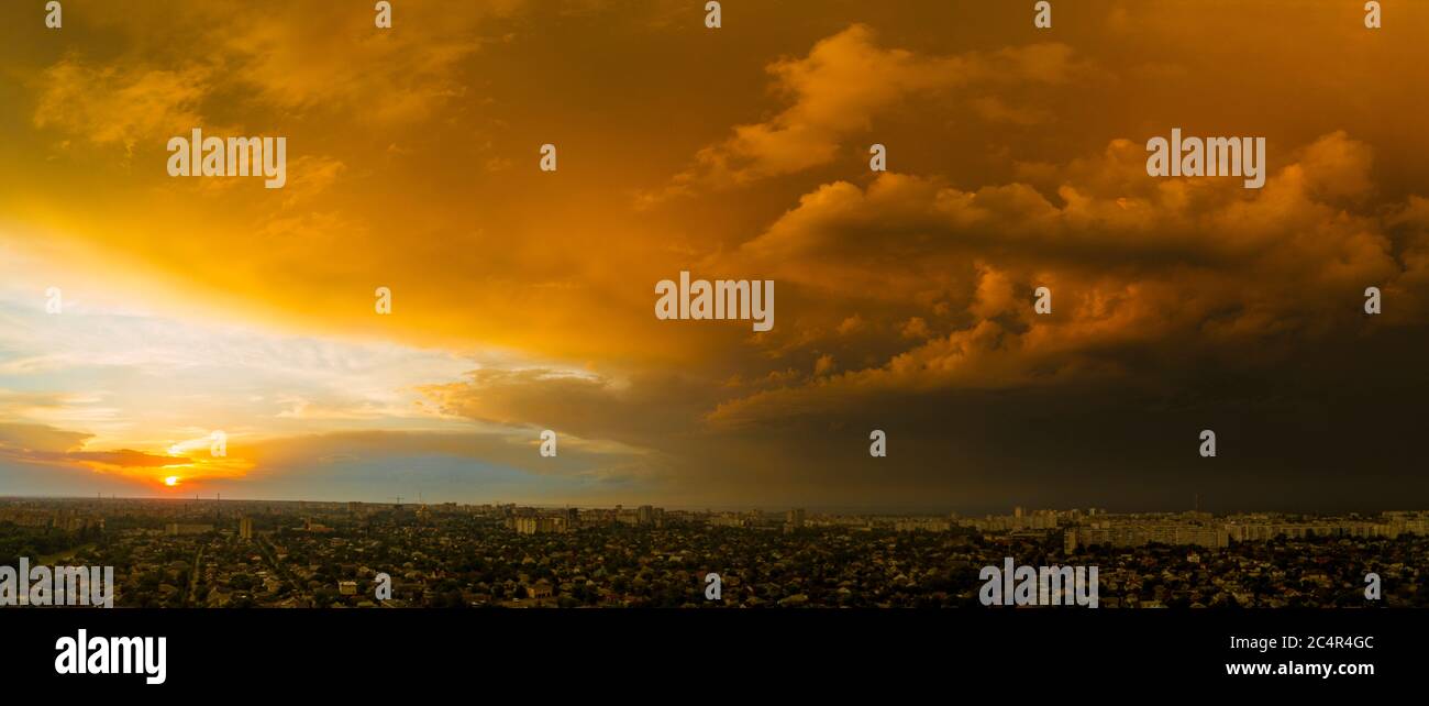 Aerial view amazing sunset over of the suburbs with the city under ...