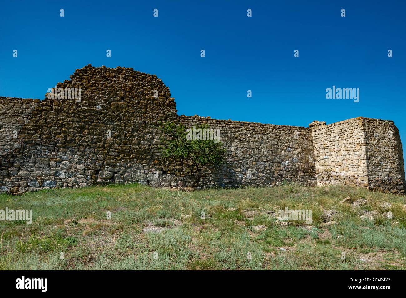 brick and stone fortress positioned on a high hill Stock Photo - Alamy