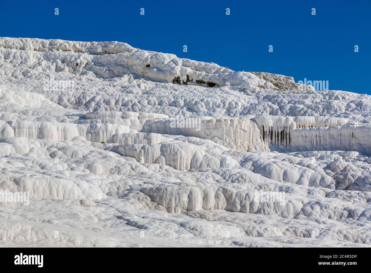 Travertine pools and terraces in Pamukkale, Turkey in a beautiful ...