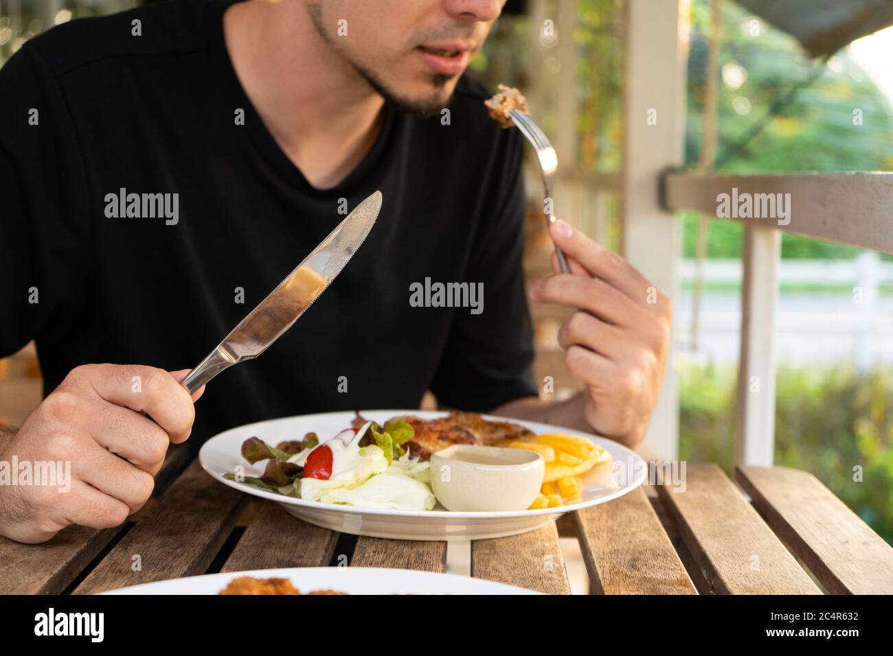 Fat Guy Eating High Resolution Stock Photography and Images - Alamy