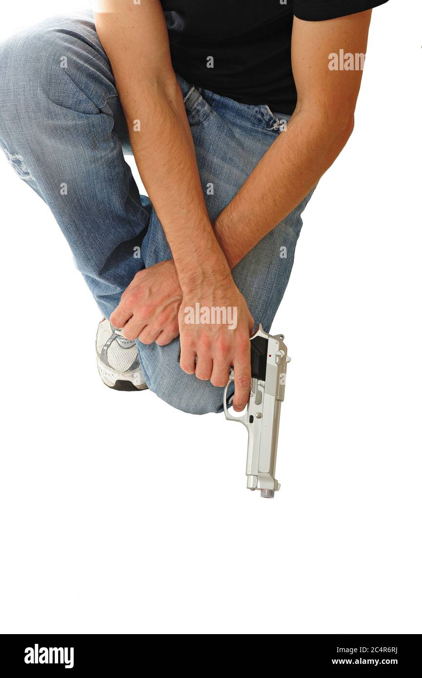 kneeling man with a gun Isolated on white background Stock Photo - Alamy