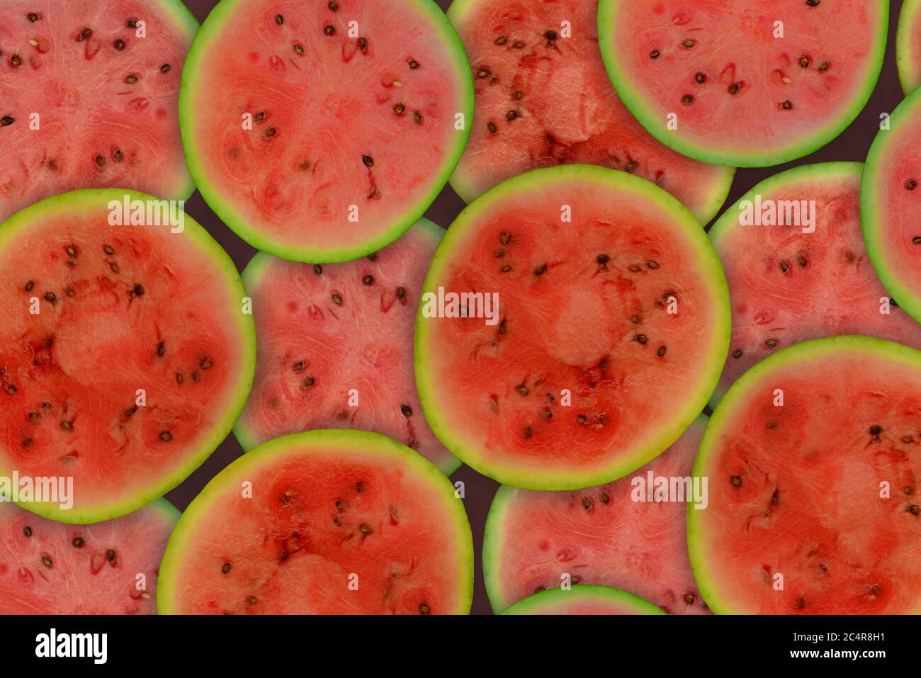 Watermelon with large red slices texture Stock Photo - Alamy