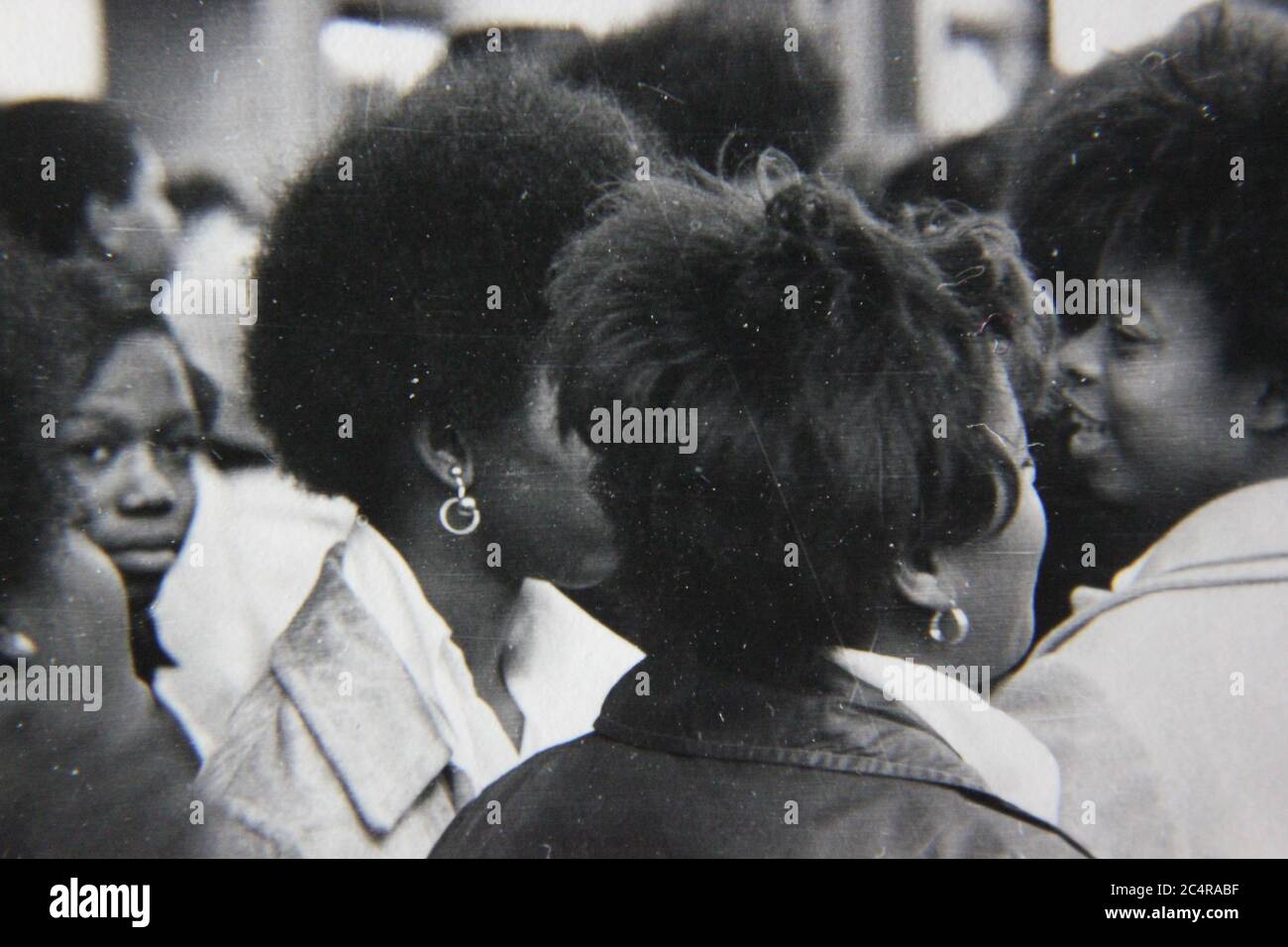 Fine 70s vintage black and white photography of a boisterous crowd in ...