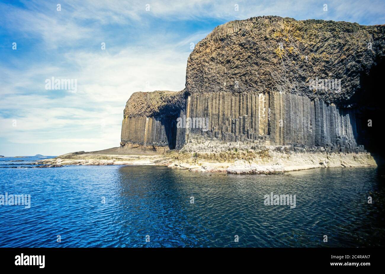 Towering sea cliffs made of hexagonal columnar basalt columns on the ...