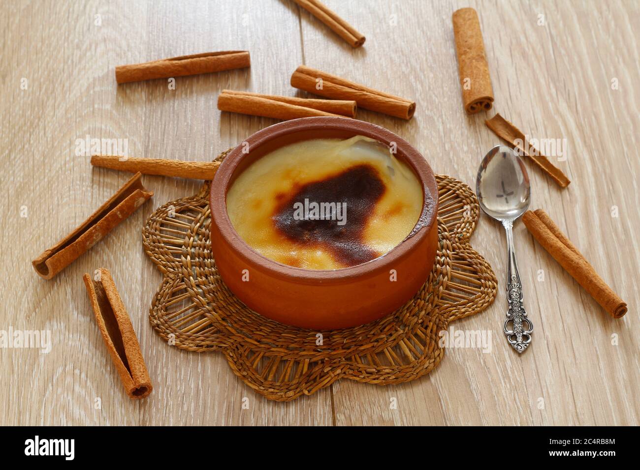 Baked rice pudding turkish dessert sutlac in earthenware casserole with ...