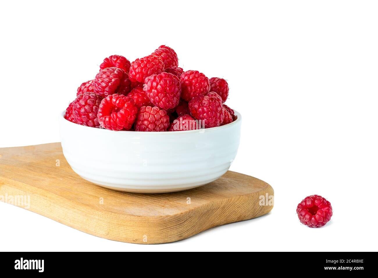 Fresh raspberries in bowl isolated on white background Stock Photo - Alamy
