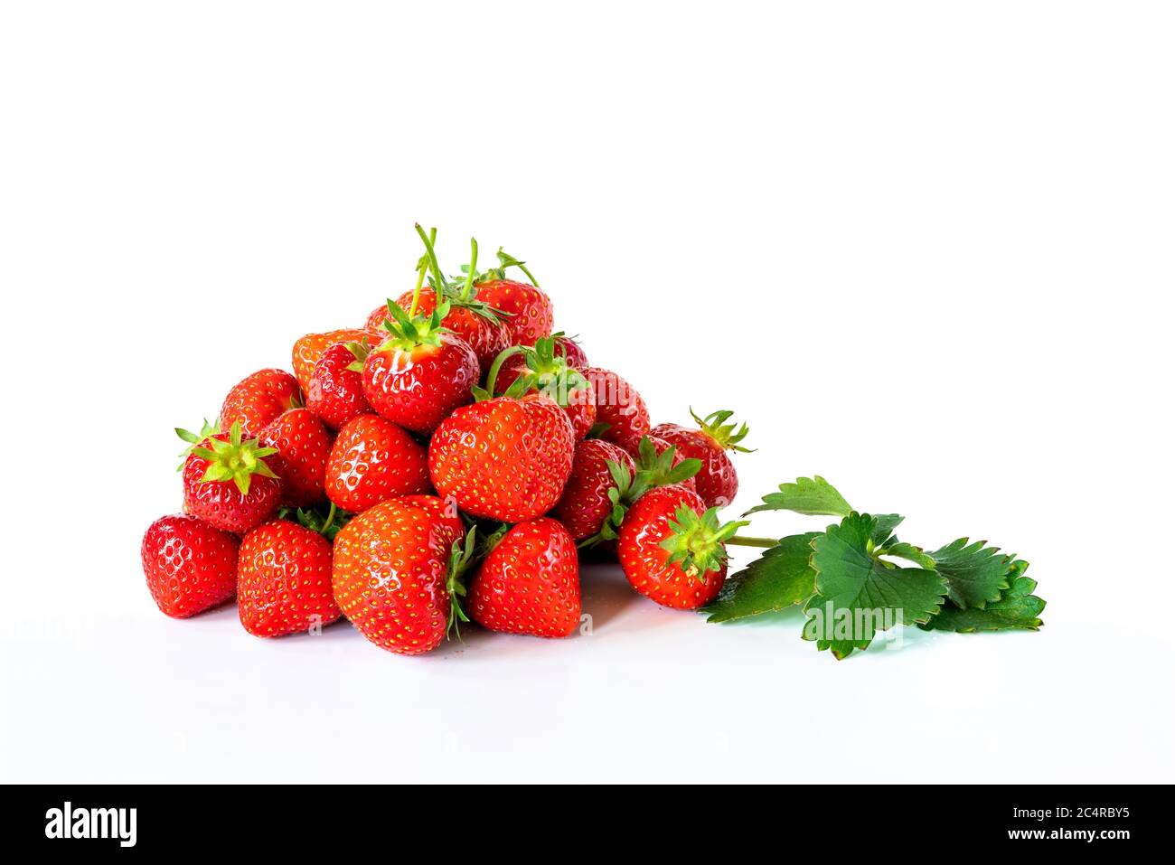 A pile of fresh strawberries isolated on white background Stock Photo ...
