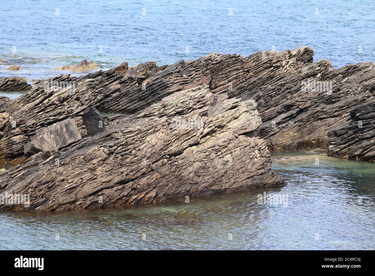 Rocks in sea Stock Photo - Alamy