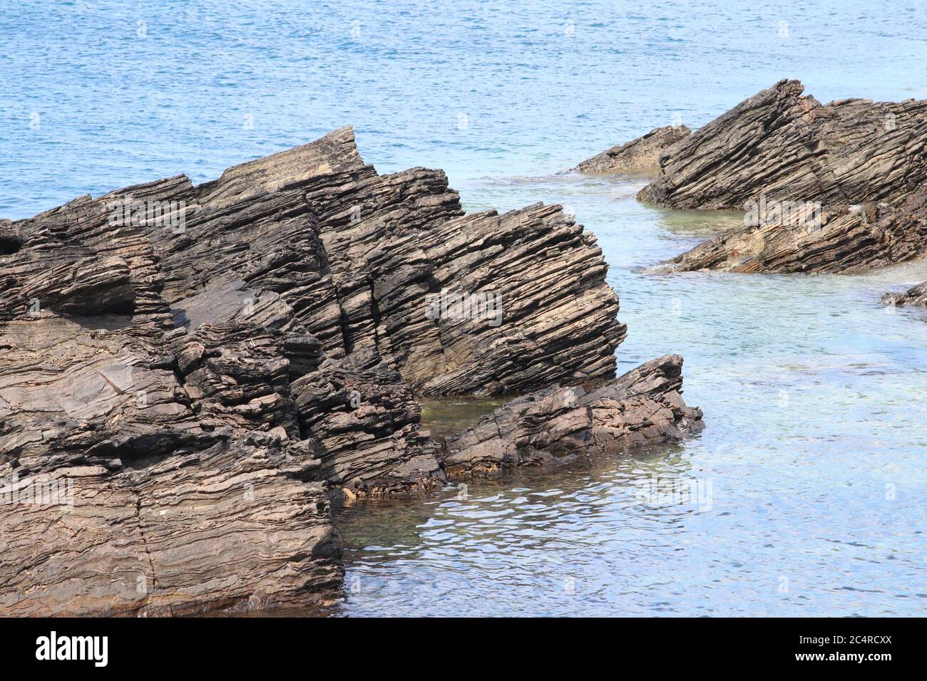 Rocks in sea Stock Photo - Alamy