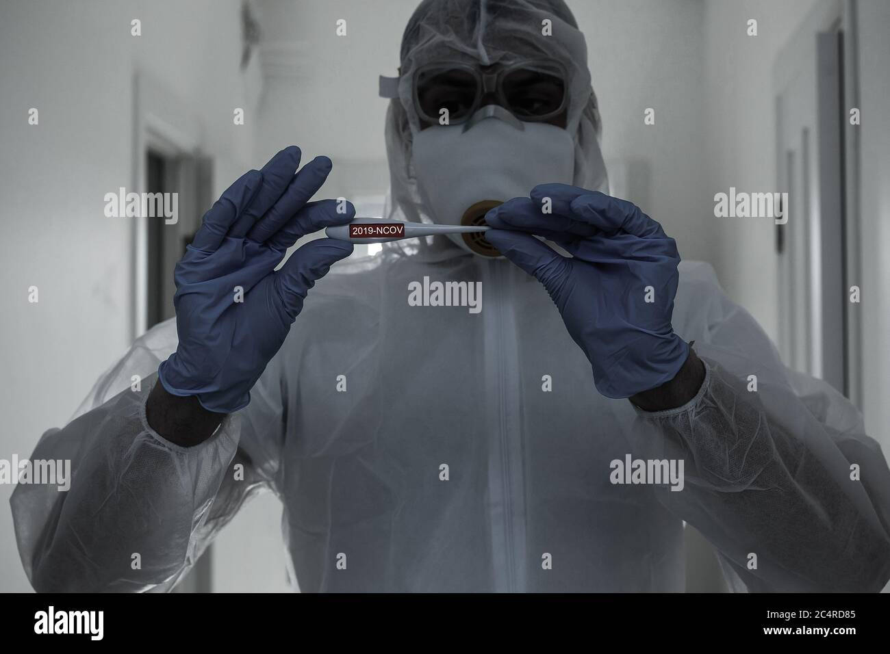 Scientist in protective gear with arms crossed in laboratory Stock ...