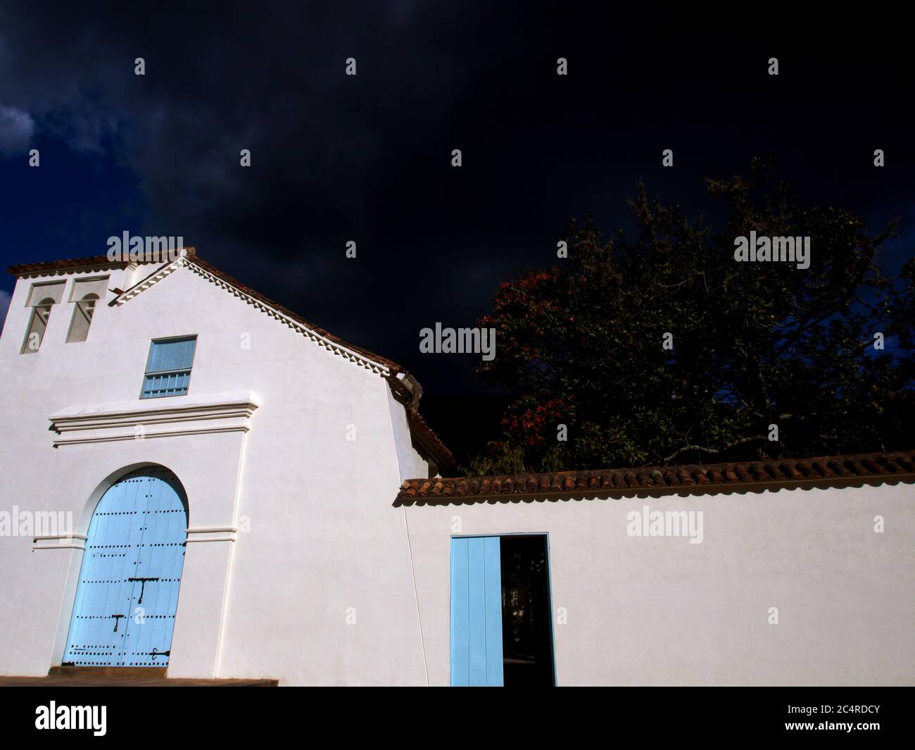 Facade of an old colonial church at the colonial town of Villa de Leyva ...