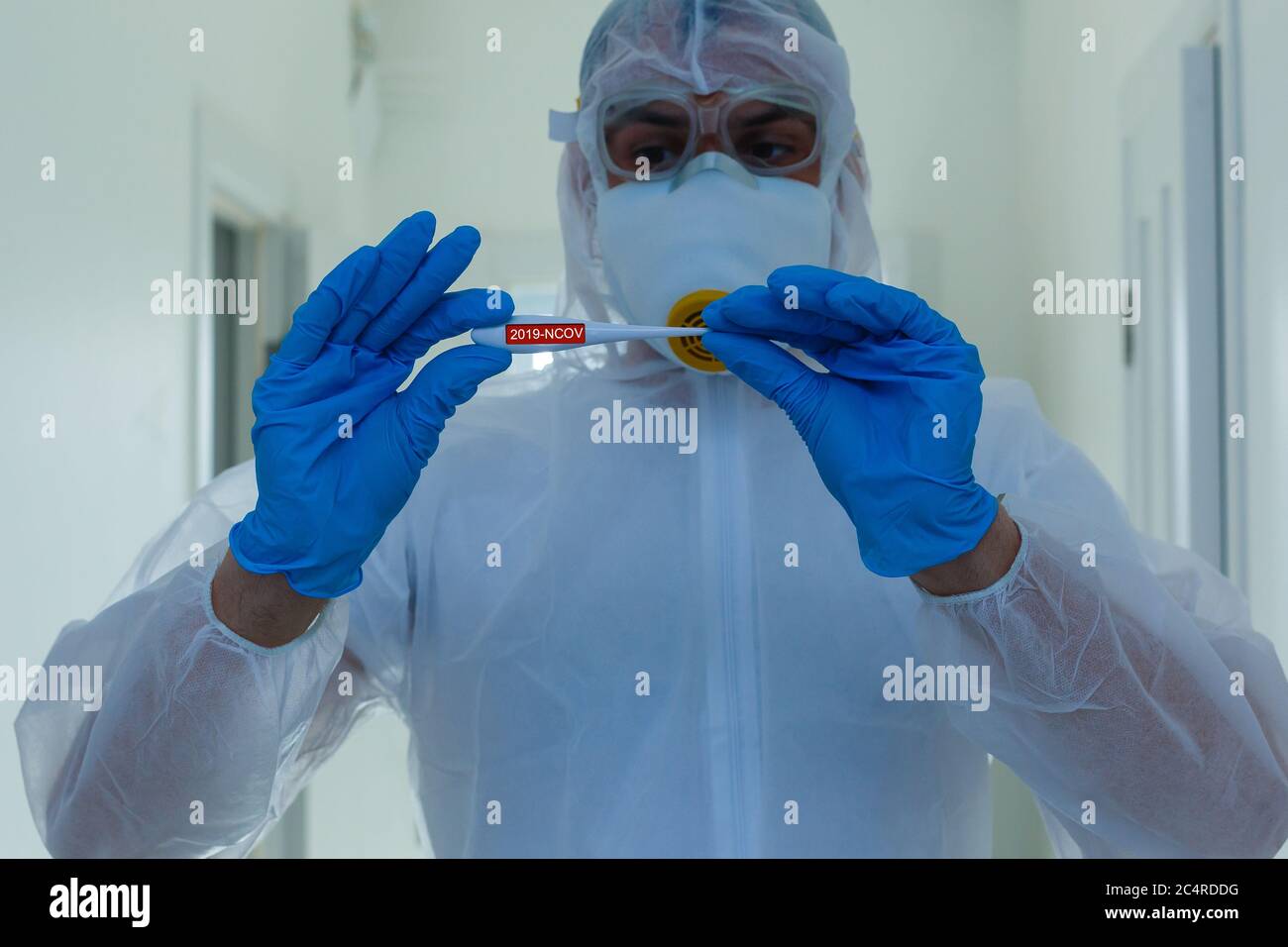 Scientist in protective gear with arms crossed in laboratory Stock ...
